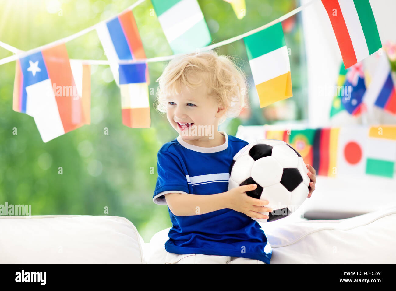 Child watching football game on tv. Little boy in France tricot ...