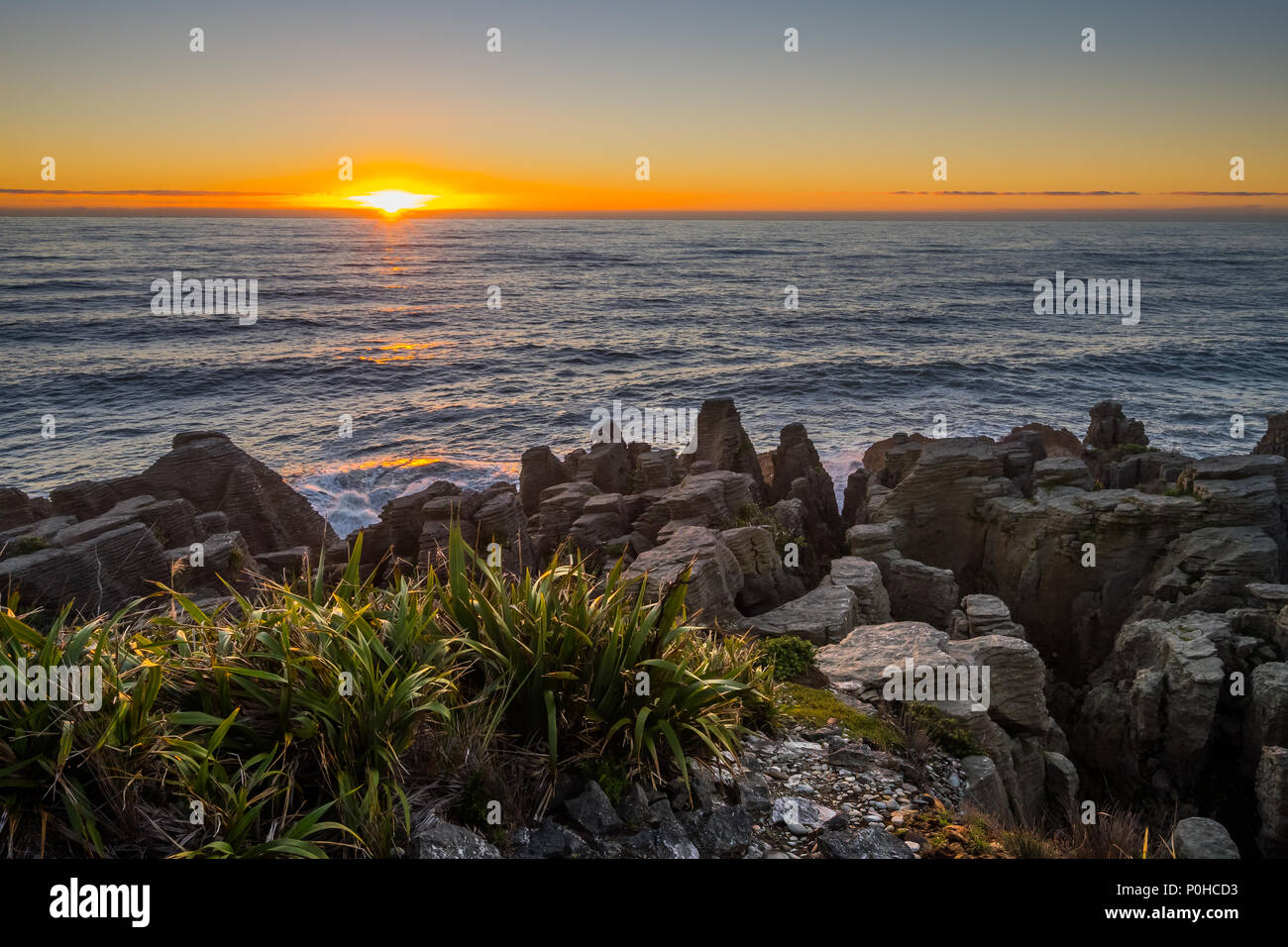 Sunset at Punakaiki pancake rocks and blowholes in the west coast of ...