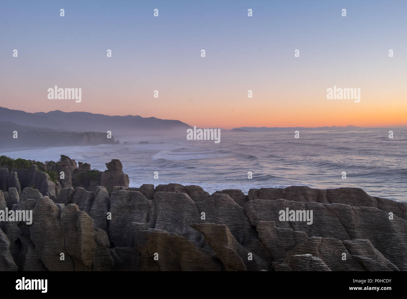 Sunset at Punakaiki pancake rocks and blowholes in the west coast of ...