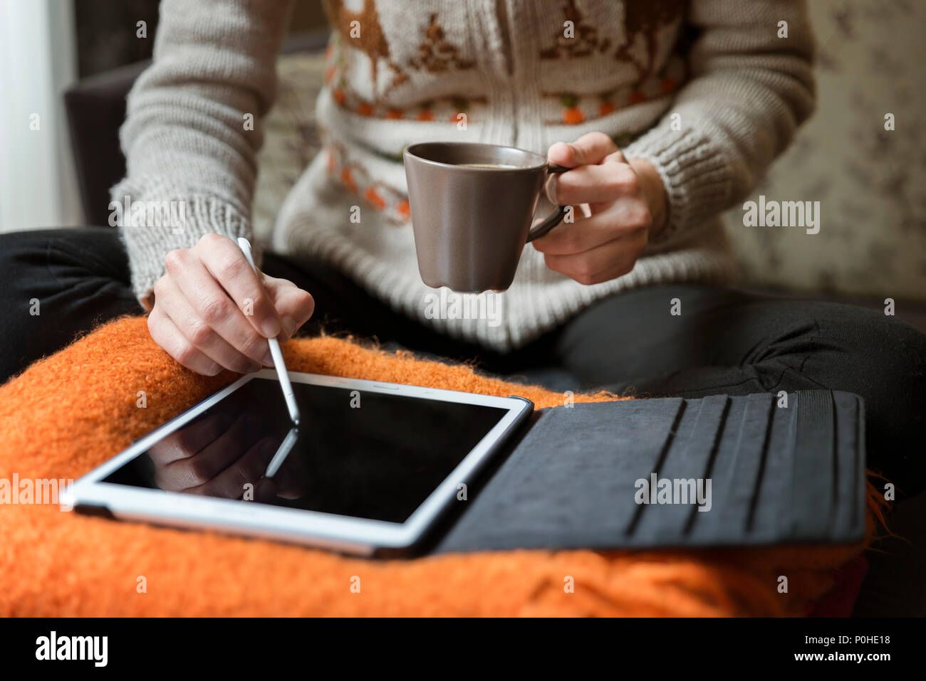 Woman home radiator cosy hi-res stock photography and images - Alamy