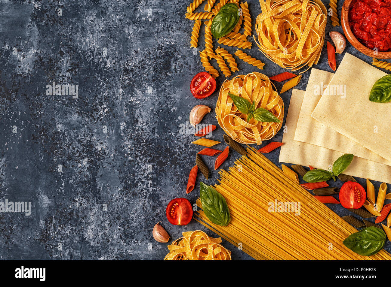 Italian food background with pasta, spices and vegetables. Top view ...