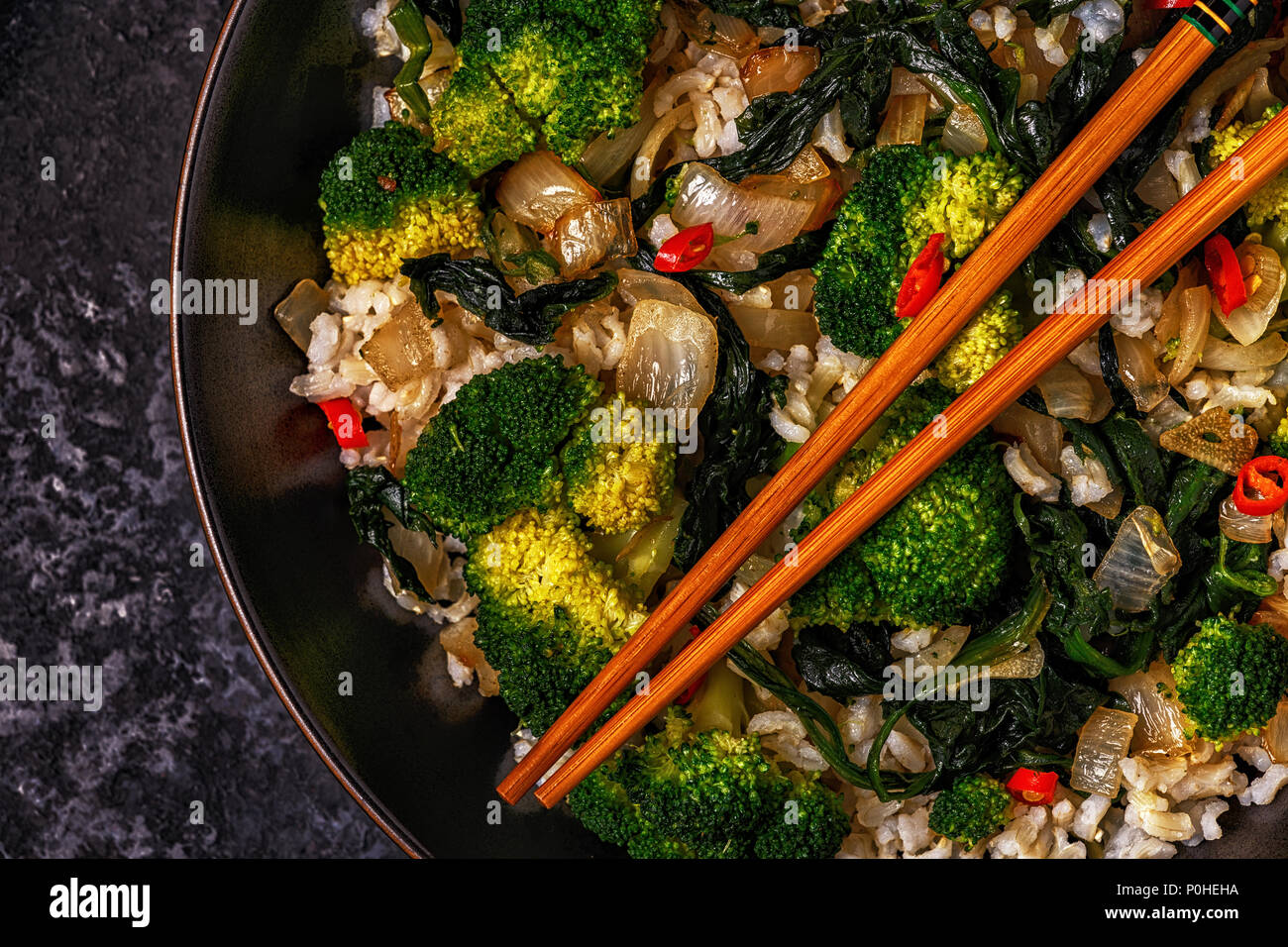 Cooking asian stir fry rice with vegetables, top view, copy space Stock ...