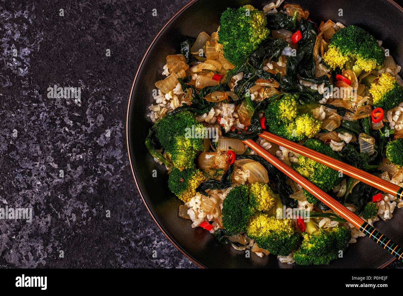 Cooking asian stir fry rice with vegetables, top view, copy space Stock ...
