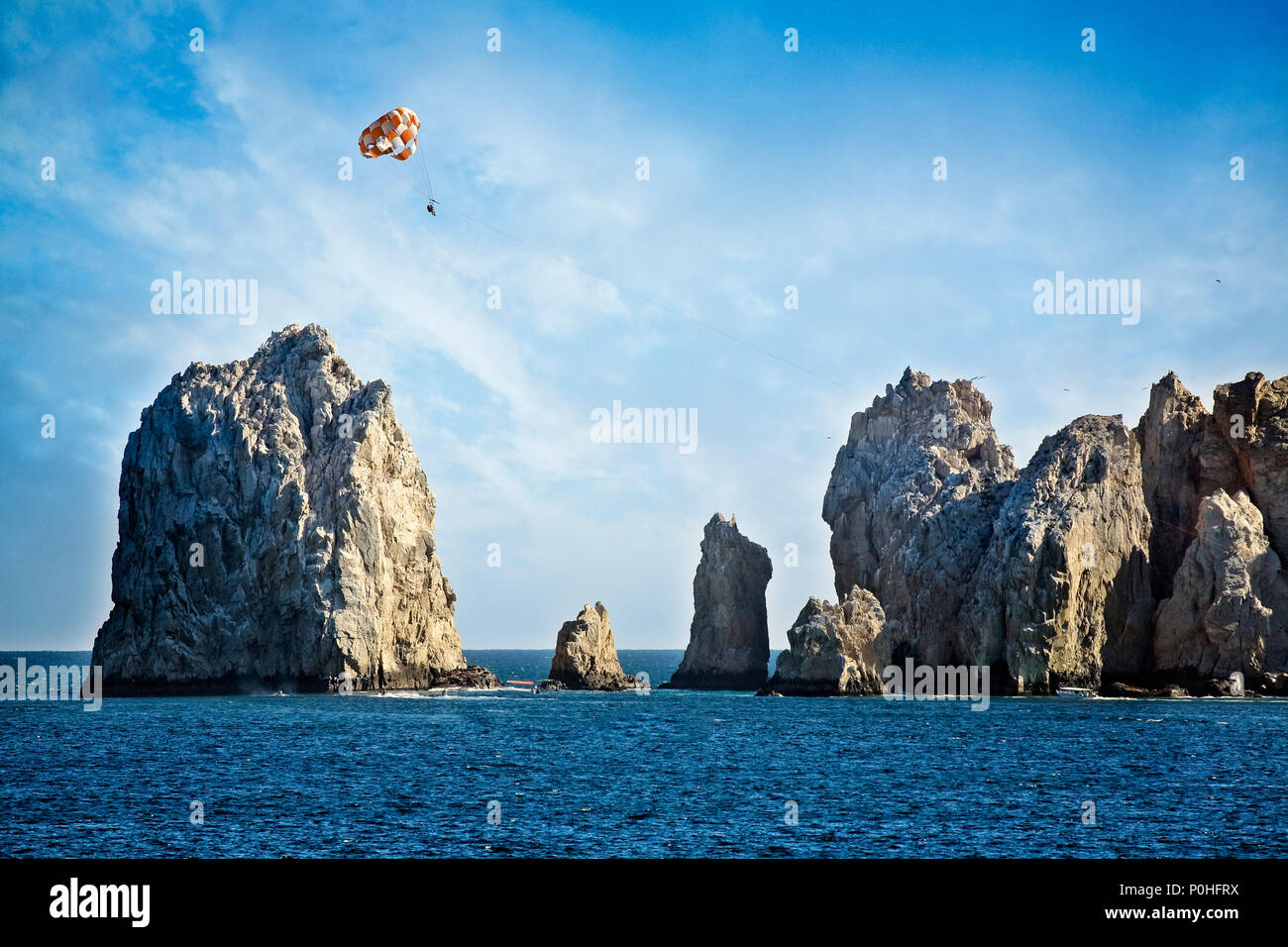 Parasailing over land's end at Cabo San Lucas, Baja, Mexico Stock Photo ...