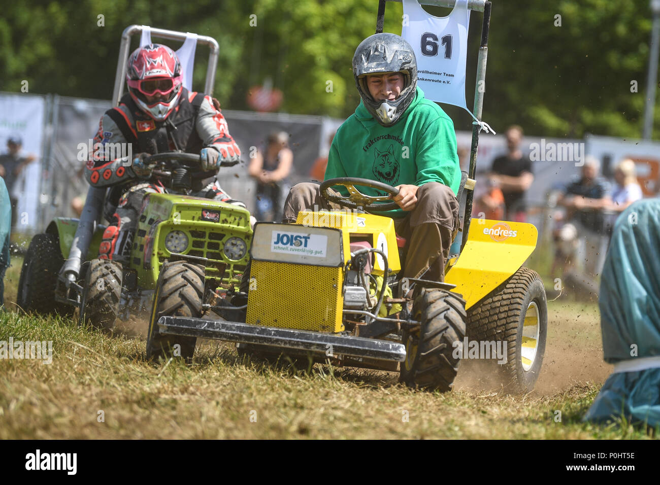 Germany, Wetzisreute, 09 June 2018, Two souped-up lawnmowers in action ...