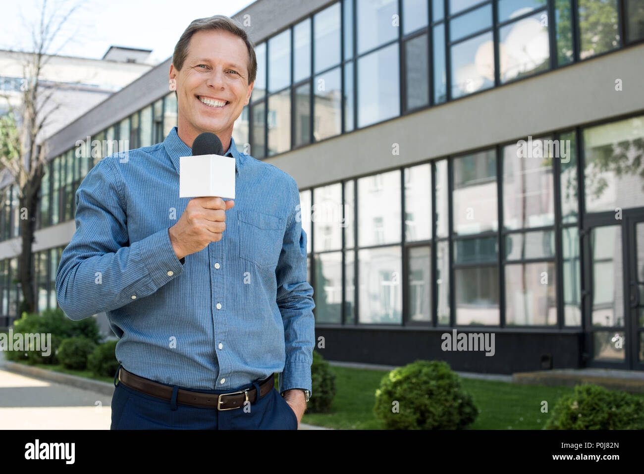 News anchor with microphone male hi-res stock photography and images ...