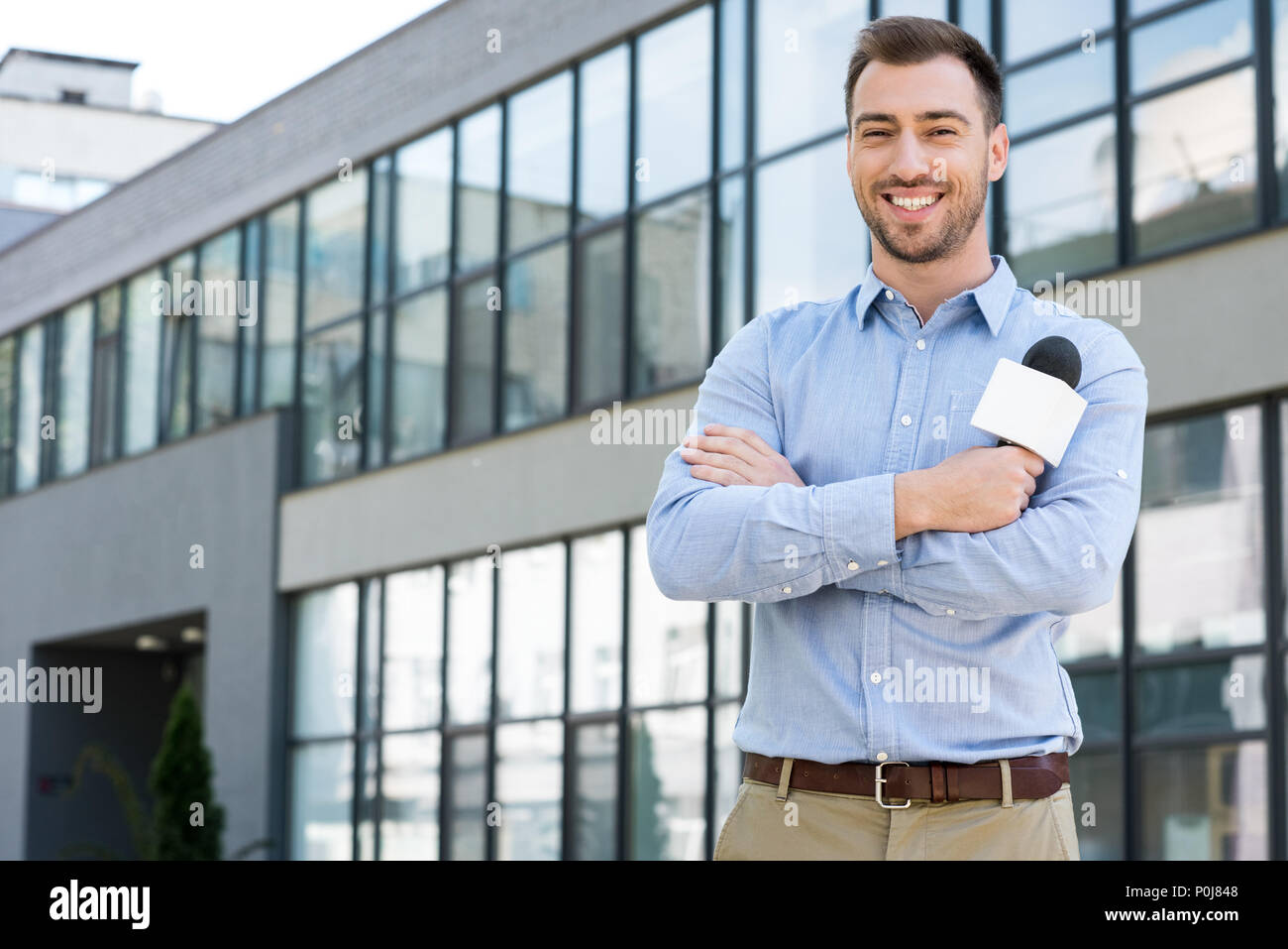 News anchor with microphone male hi-res stock photography and images ...