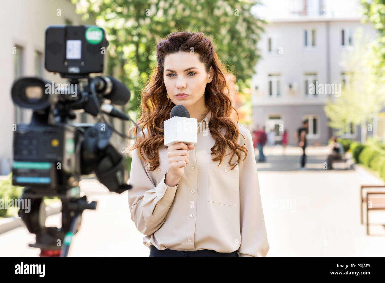 News Reporter In Front Of Tv Camera High Resolution Stock Photography ...
