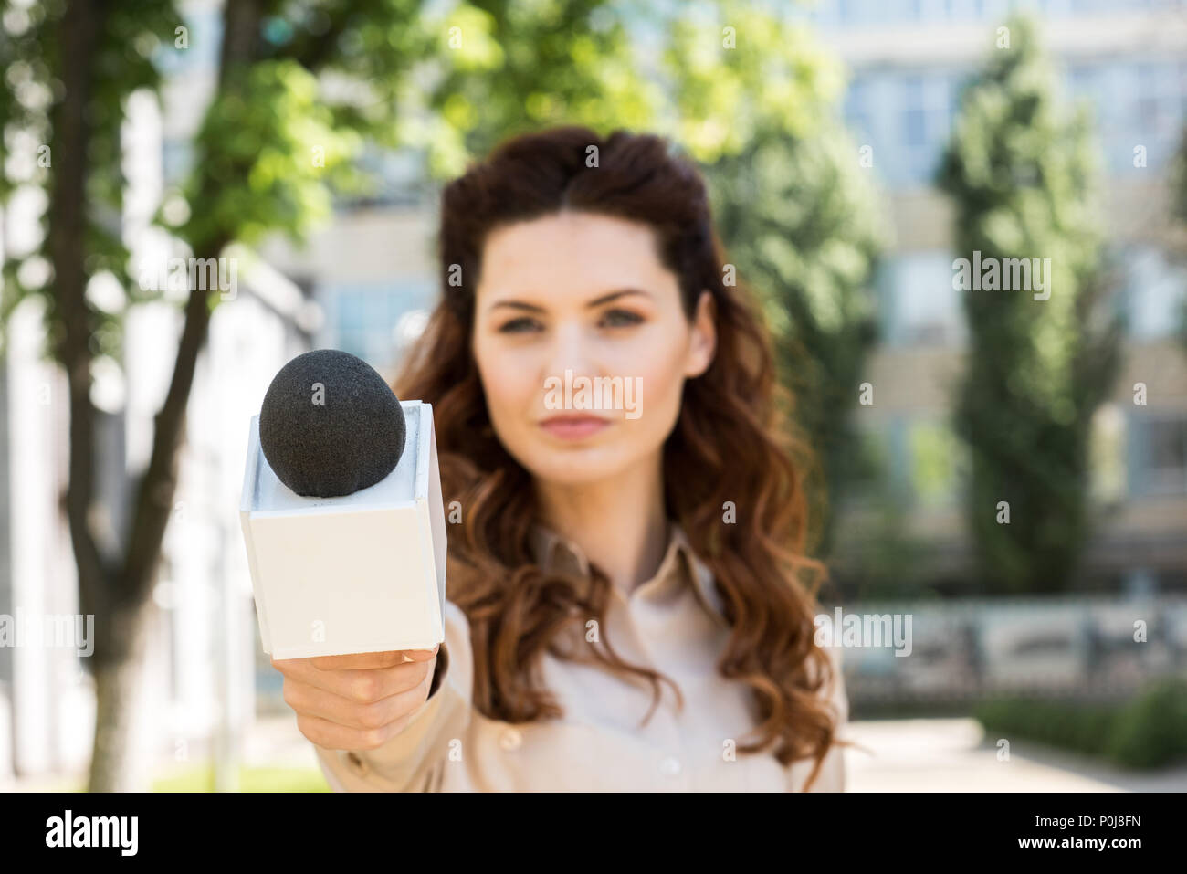Female reporter taking interview hi-res stock photography and images ...