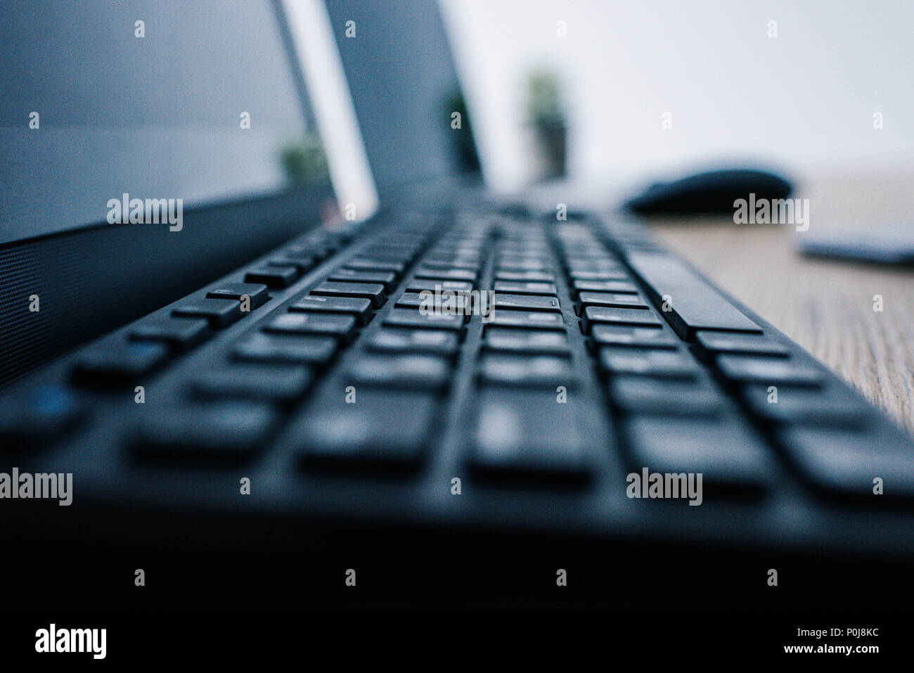 close up view of computer keyboard at table with computer mouse and ...