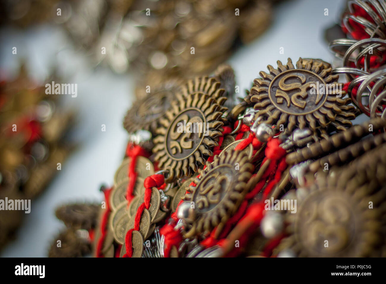 Key chain with Religious symbol Om Stock Photo - Alamy