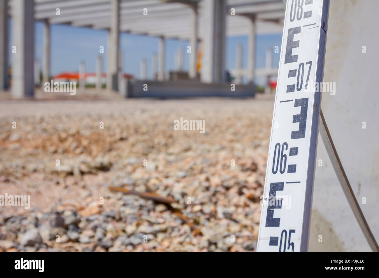 Leveling lath is helping surveyor, geodesist to measure position, depth ...