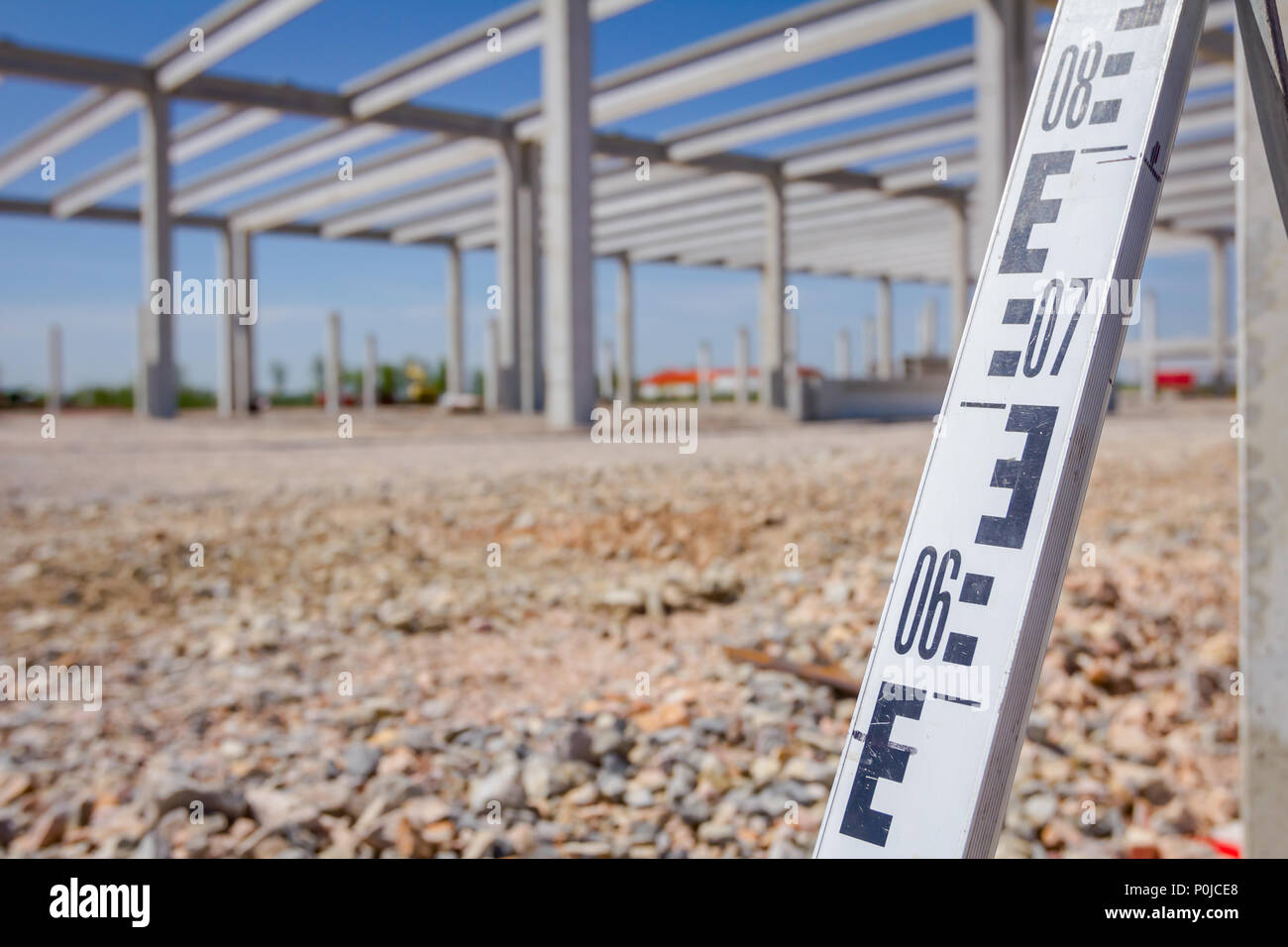 Leveling lath is helping surveyor, geodesist to measure position, depth ...