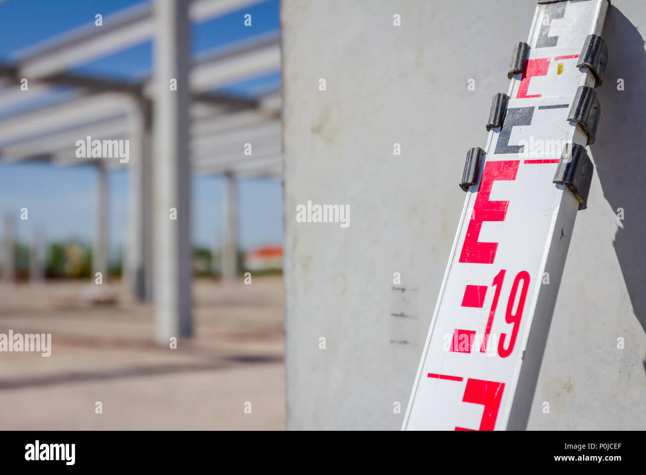 Telescopic leveling lath is helping surveyor, geodesist to measure ...