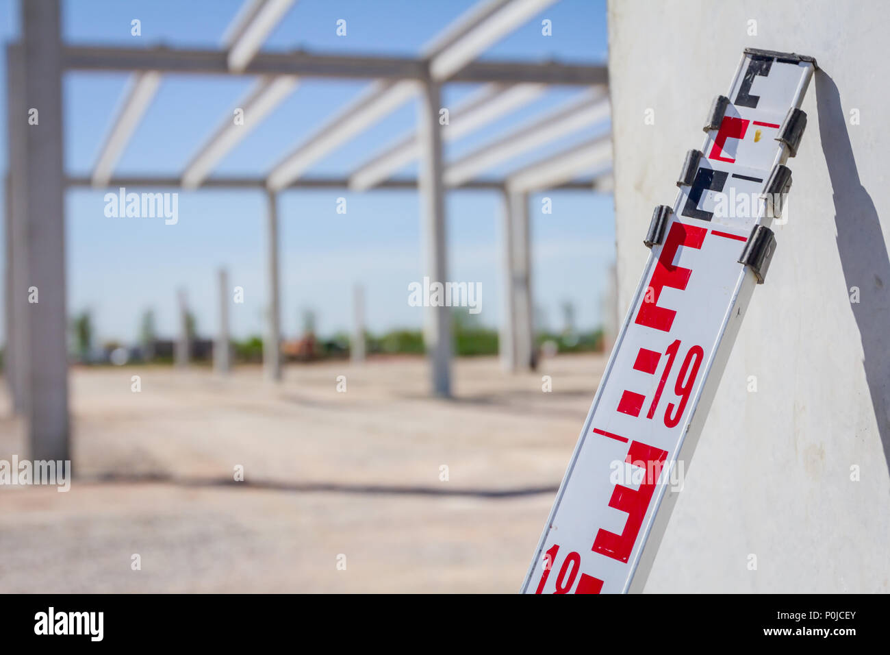 Telescopic leveling lath is helping surveyor, geodesist to measure ...