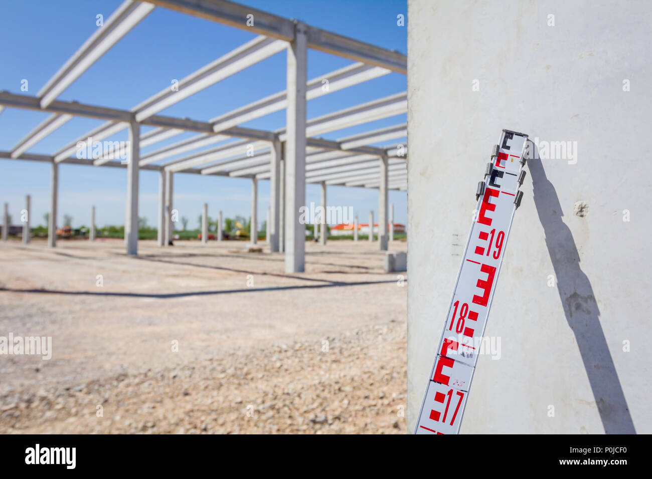 Telescopic leveling lath is helping surveyor, geodesist to measure ...