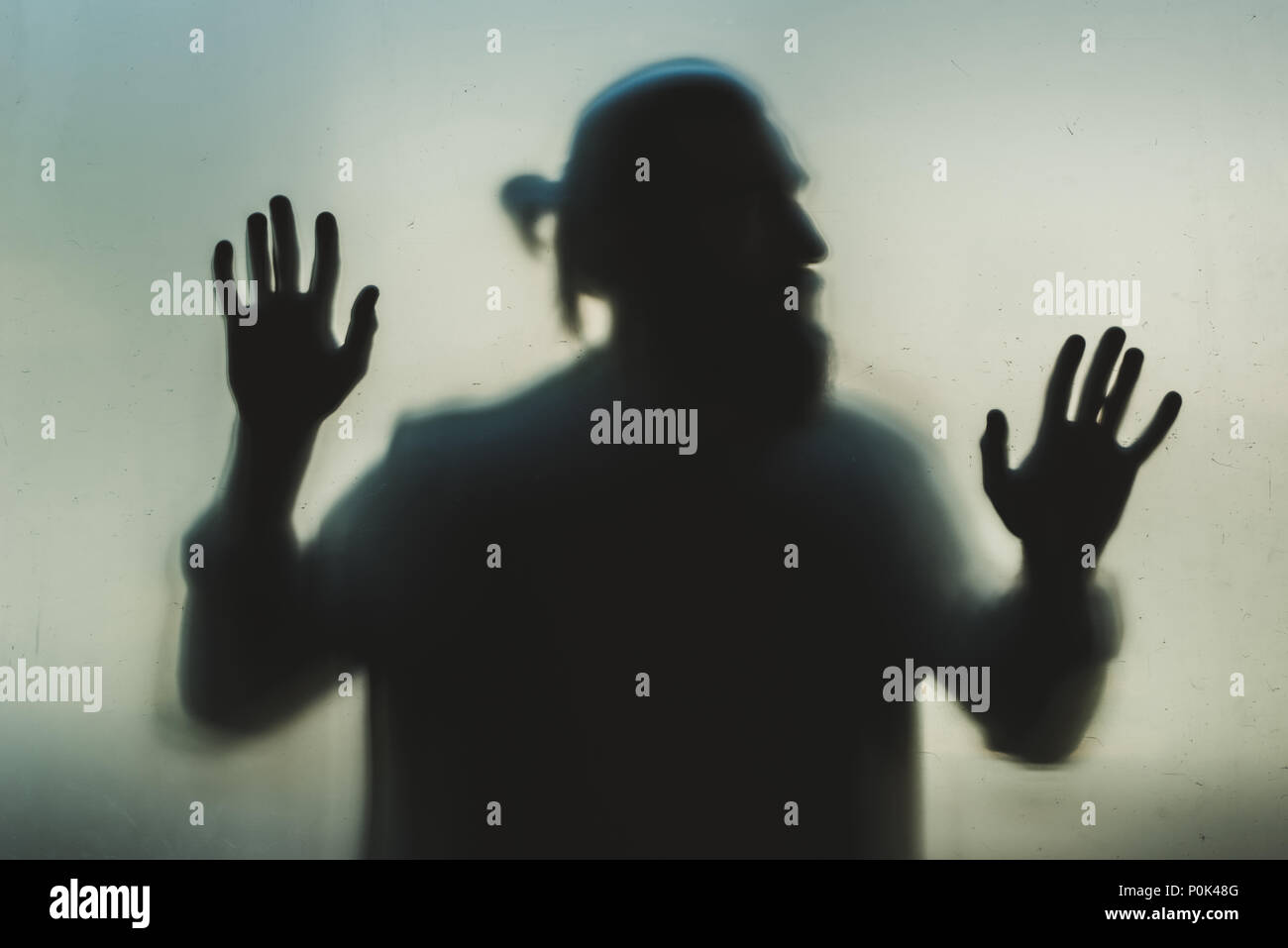 Silhouette man behind frosted glass hi-res stock photography and images ...