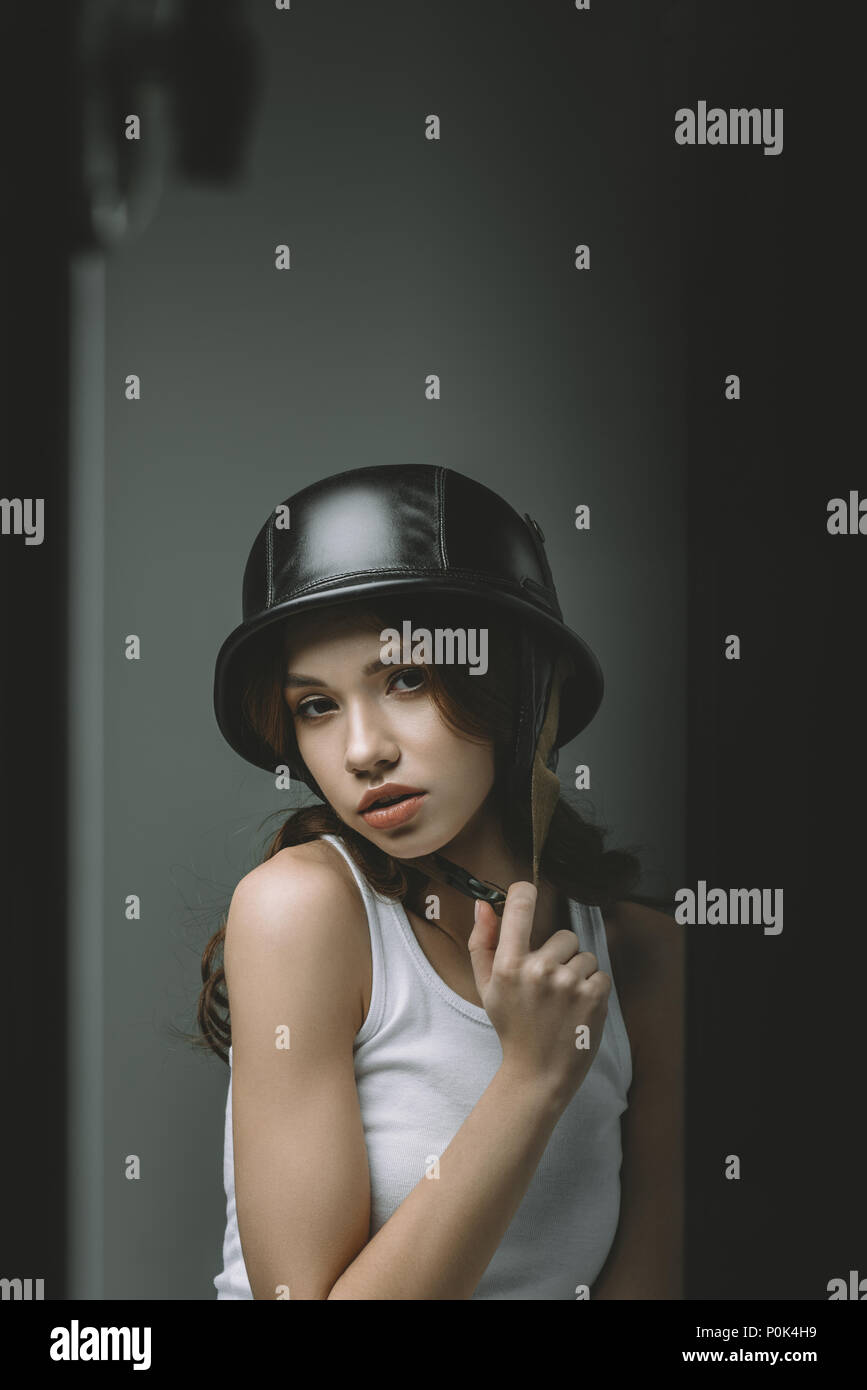 attractive young model posing in military helmet for fashion shoot ...