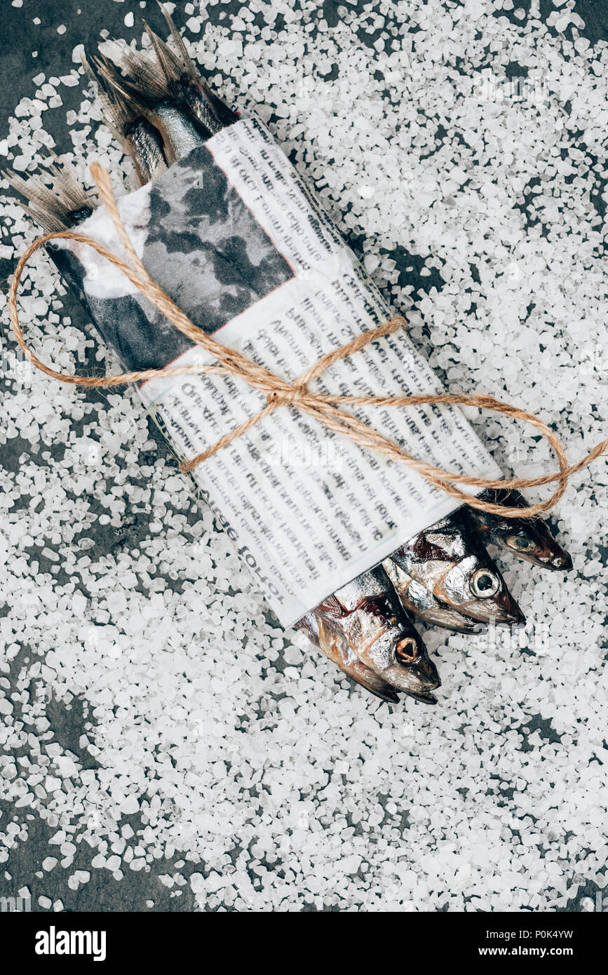 Fish wrapped in newspaper hi-res stock photography and images - Alamy