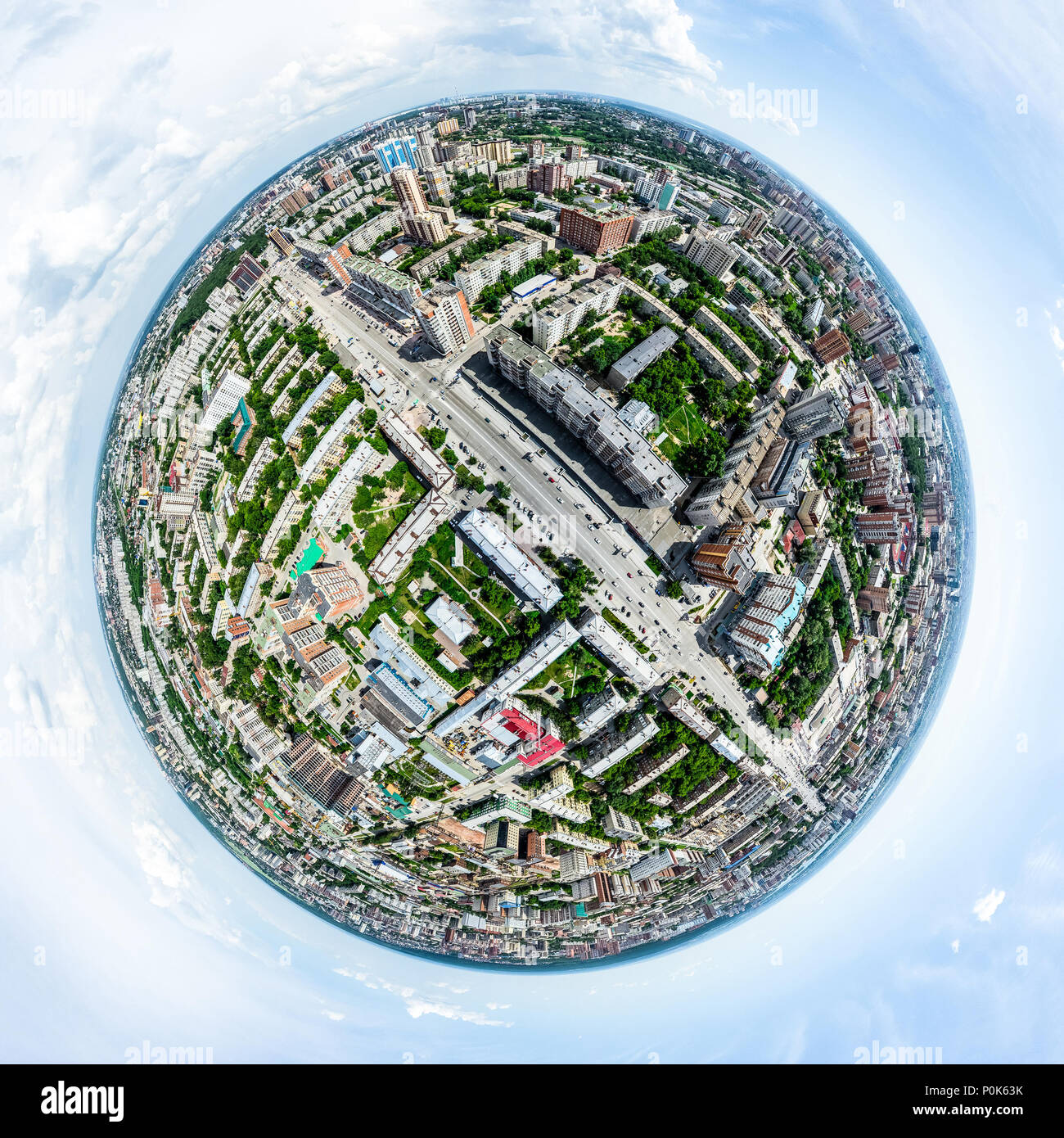 Aerial city view with crossroads and roads, houses, buildings, parks ...