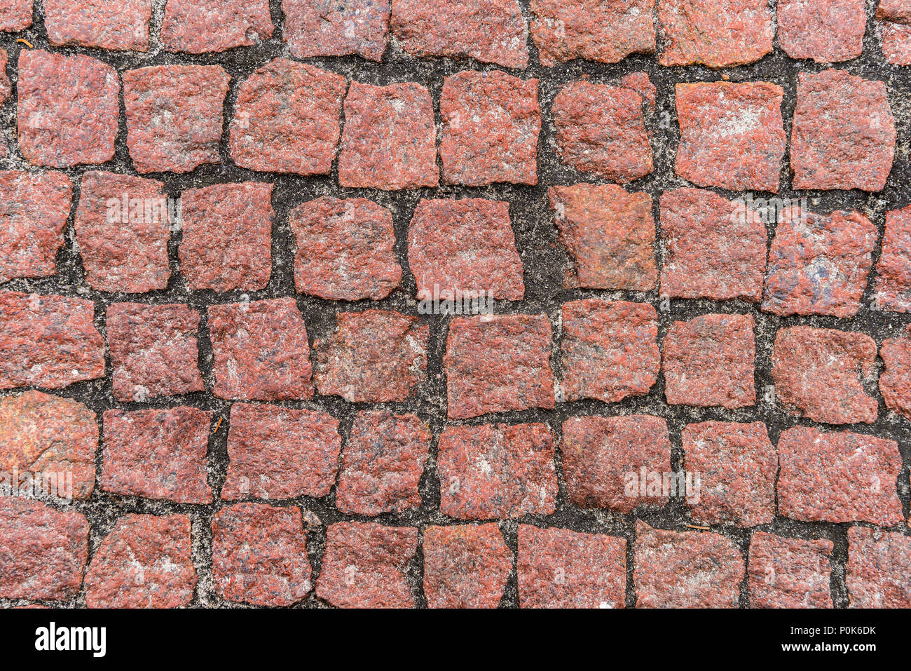 Red pebble stones road surface Stock Photo - Alamy