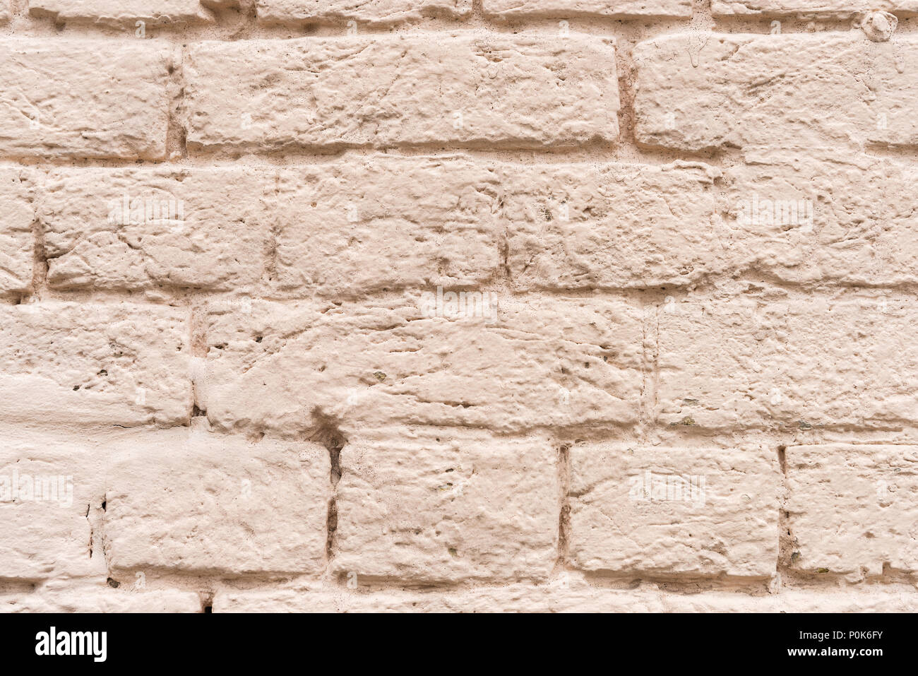 Brick wall painted in beige color Stock Photo - Alamy