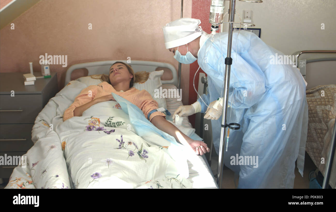 Woman hospital gown injection hi-res stock photography and images - Alamy