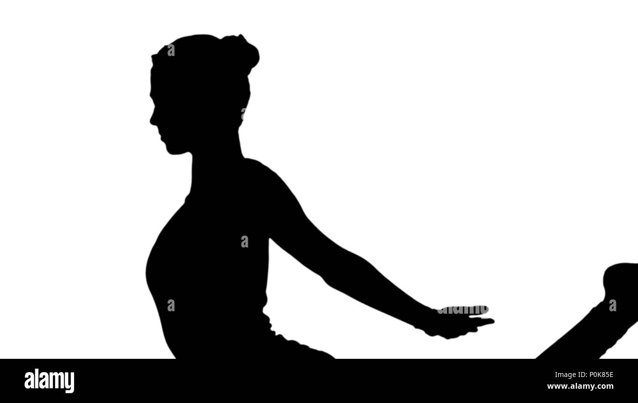 Side view portrait of beautiful young woman doing yoga or pilates ...