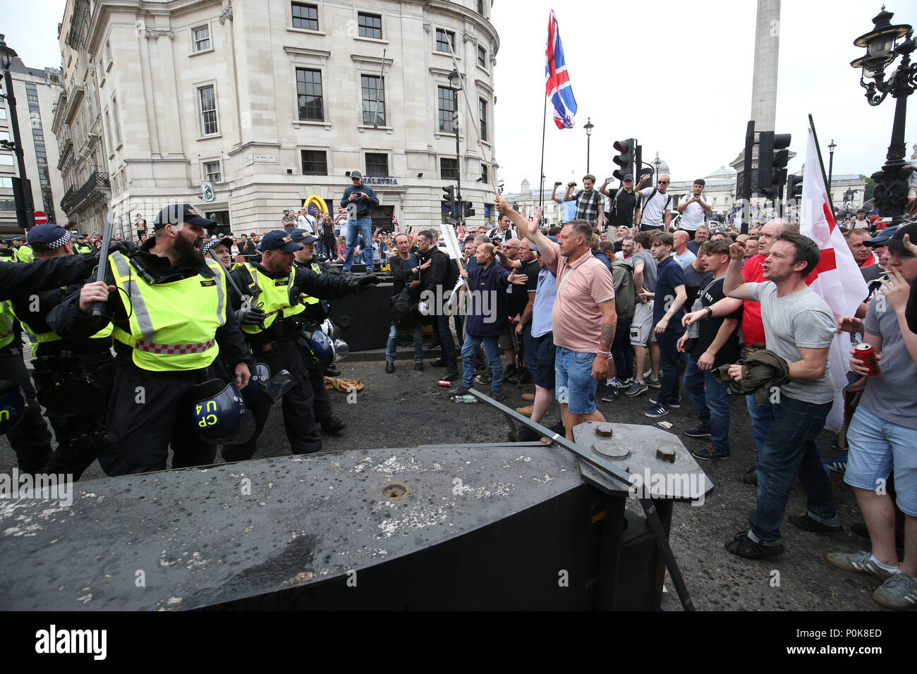 Police using batons hi-res stock photography and images - Alamy