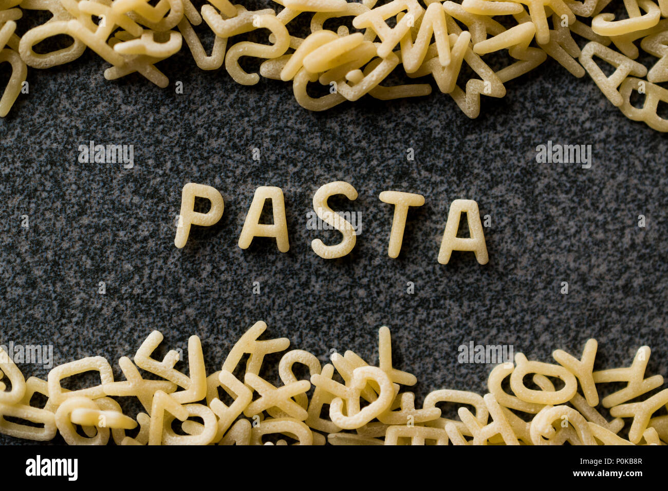 Raw Alphabet Pasta is Written with Letters on Granit Grey Surface ...