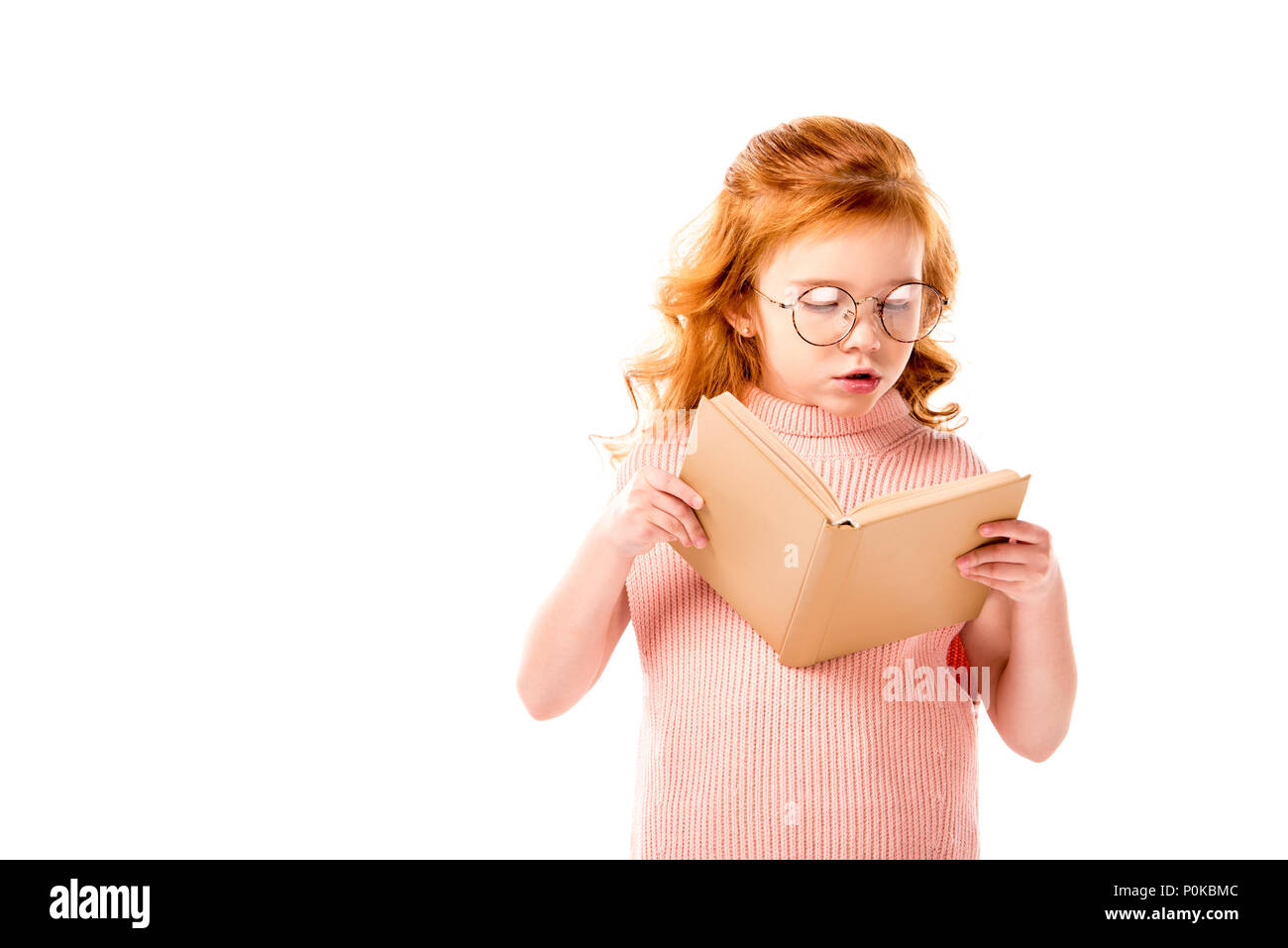 red hair kid reading book isolated on white Stock Photo - Alamy