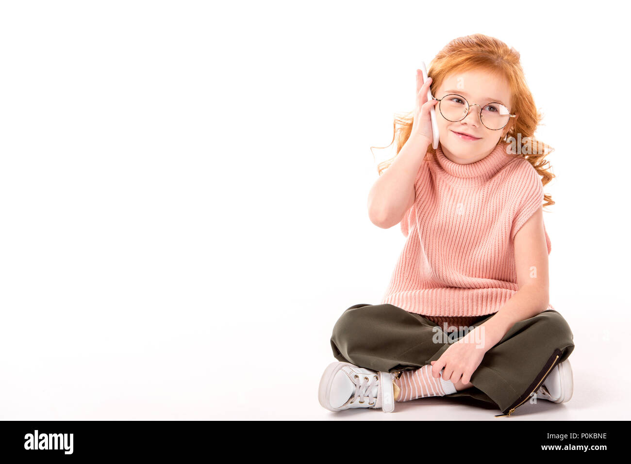 kid with ginger hair talking by smartphone on white Stock Photo - Alamy