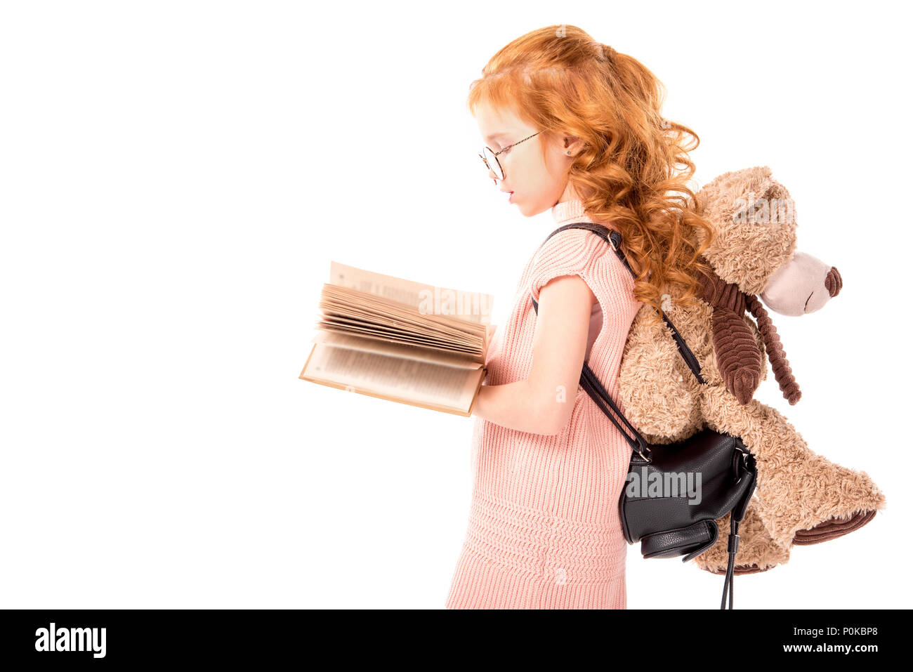 red hair kid reading book isolated on white Stock Photo - Alamy