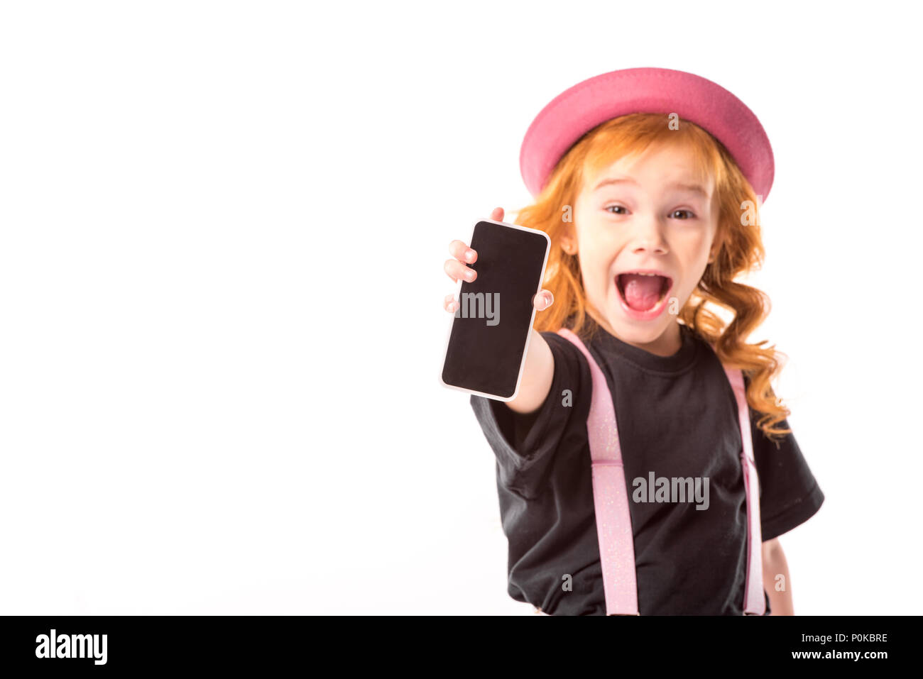 screaming red hair kid showing smartphone isolated on white Stock Photo ...