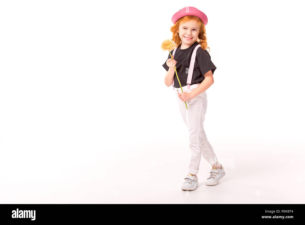 smiling kid holding flower on white Stock Photo - Alamy