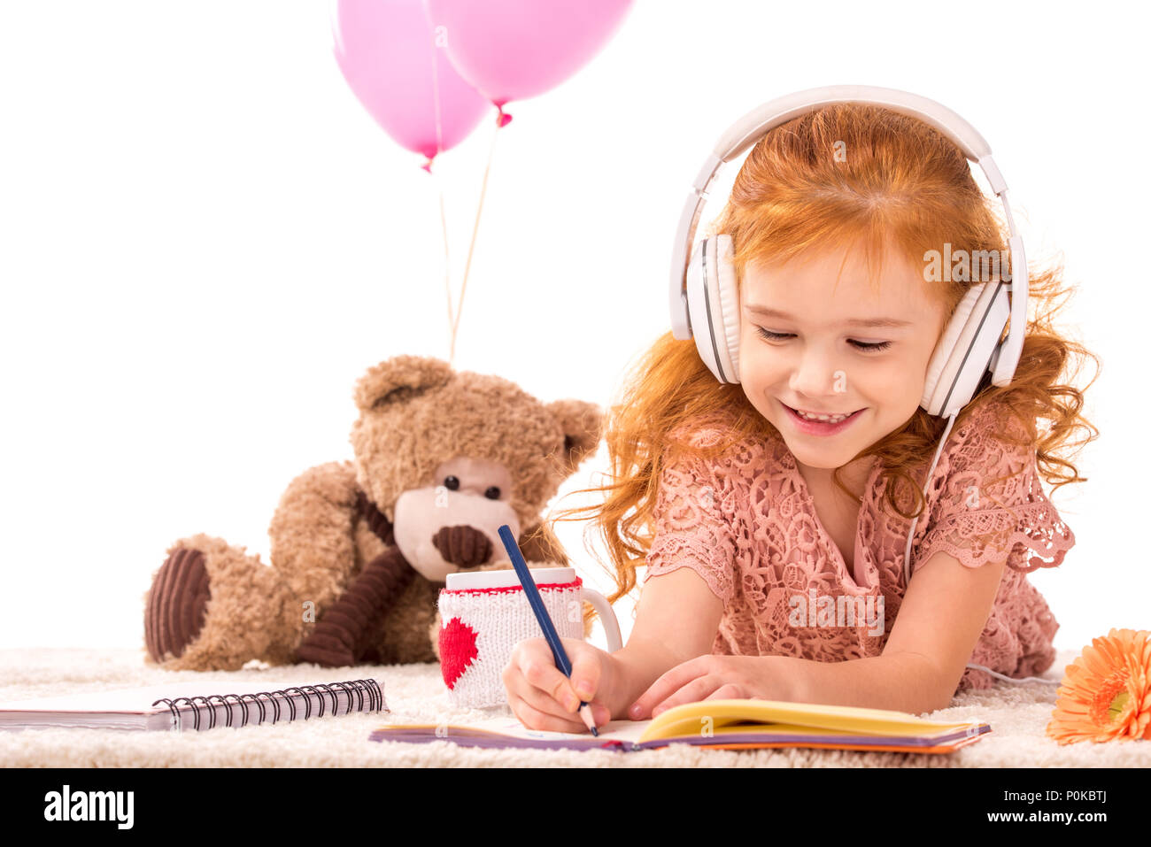 smiling kid drawing and listening music isolated on white Stock Photo ...