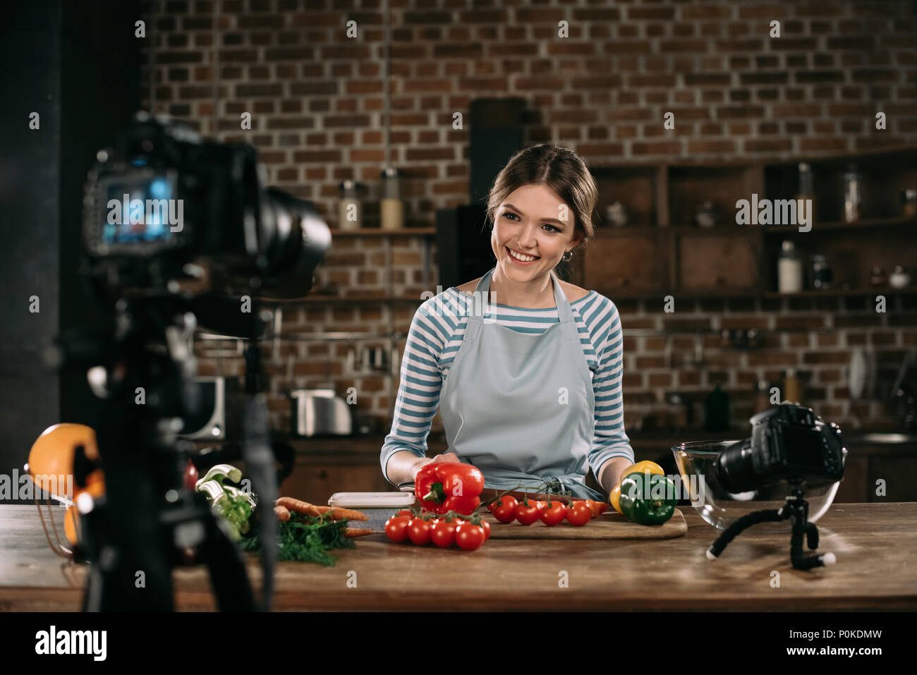 young food blogger smiling to camera Stock Photo - Alamy