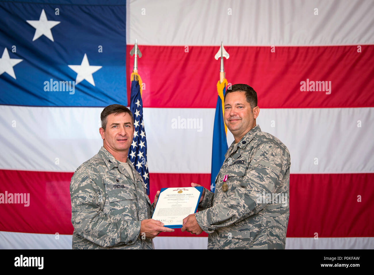 Col. John Chastain, left, 23d Maintenance Group commander poses for a ...