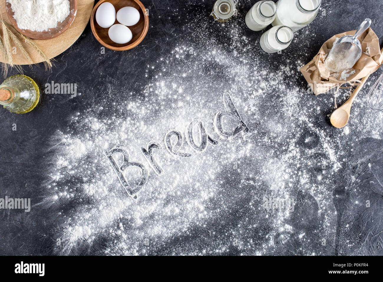top view of bread lettering made of flour and various ingredients for ...