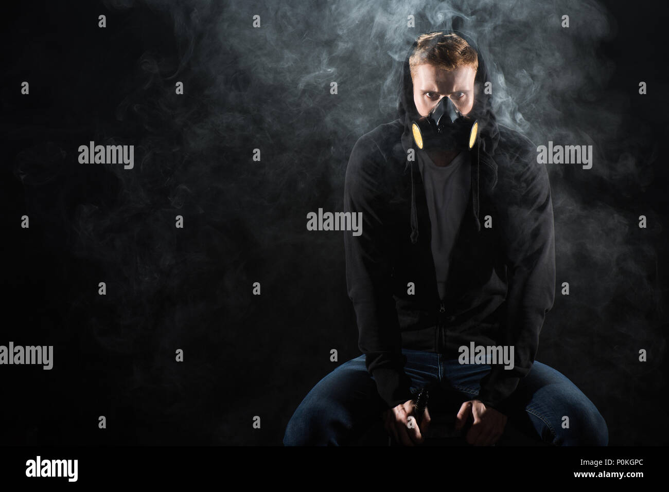 Man wearing protective filter mask smoking electronic cigarette Stock ...