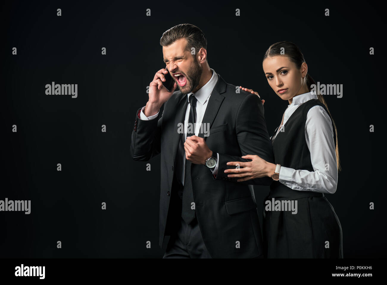 angry boss yelling while talking on smartphone, businesswoman standing ...