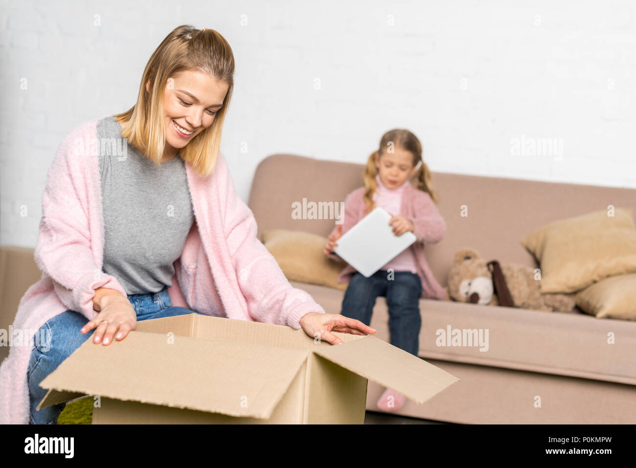 Woman packing cardboard box hi-res stock photography and images - Alamy