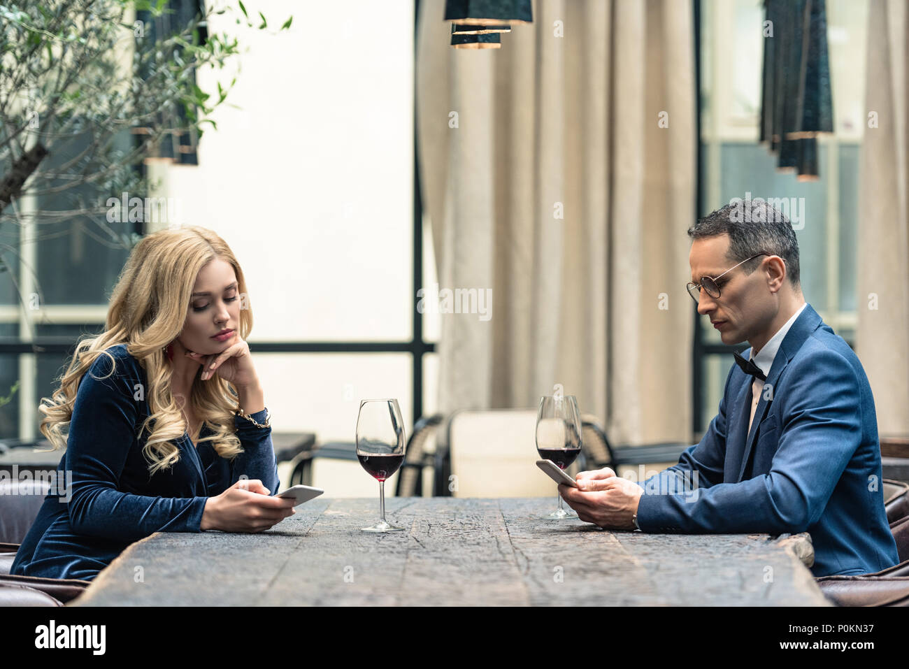 Couple restaurant bored hi-res stock photography and images - Alamy