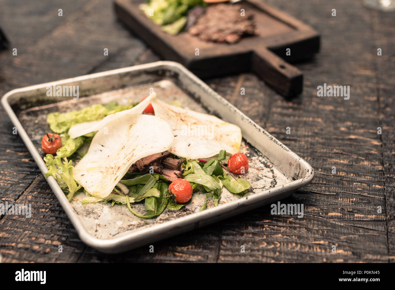 delicious restaurant food on wooden rustic table Stock Photo - Alamy