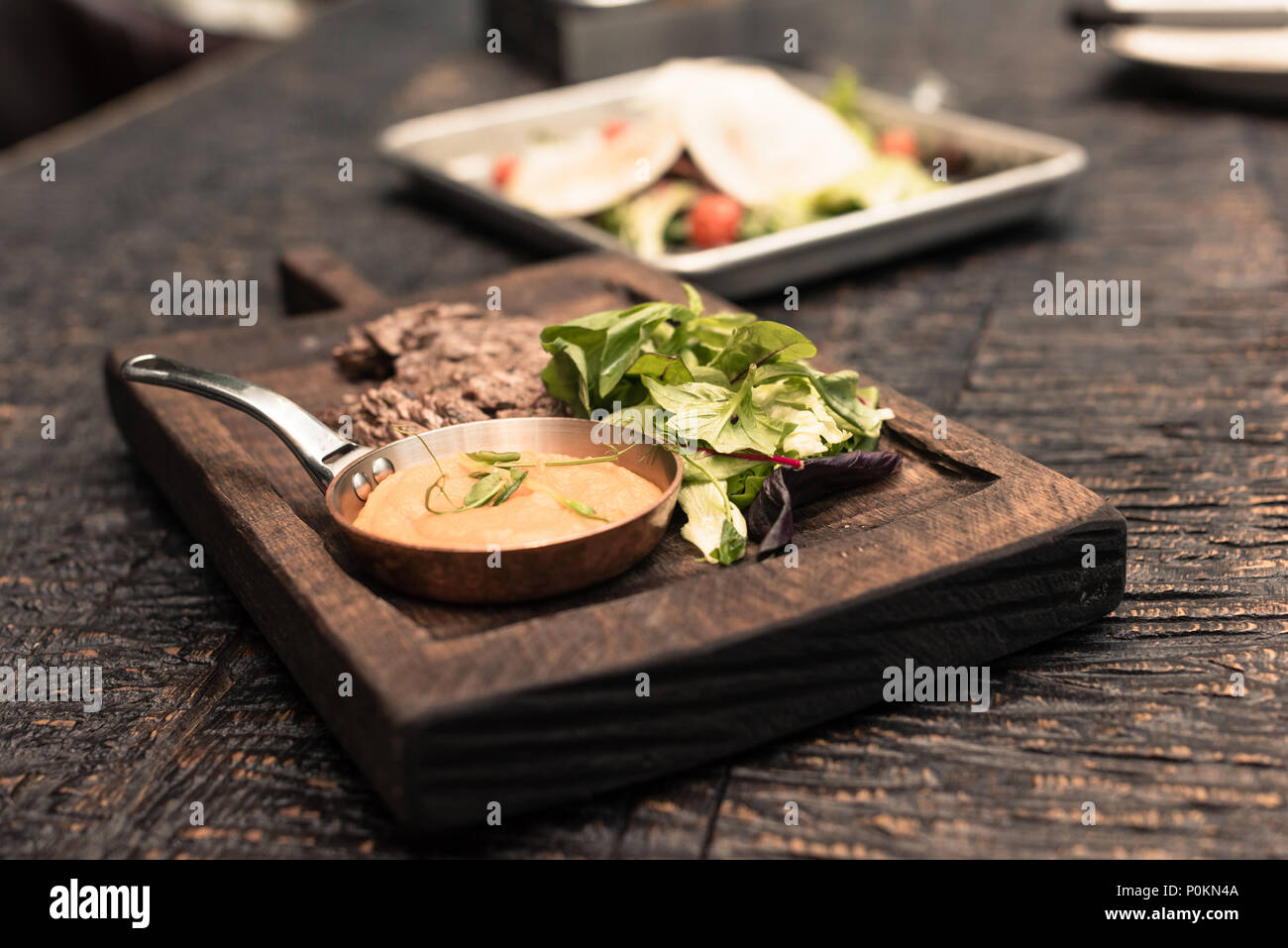 gourmet restaurant food on wooden rustic table Stock Photo - Alamy