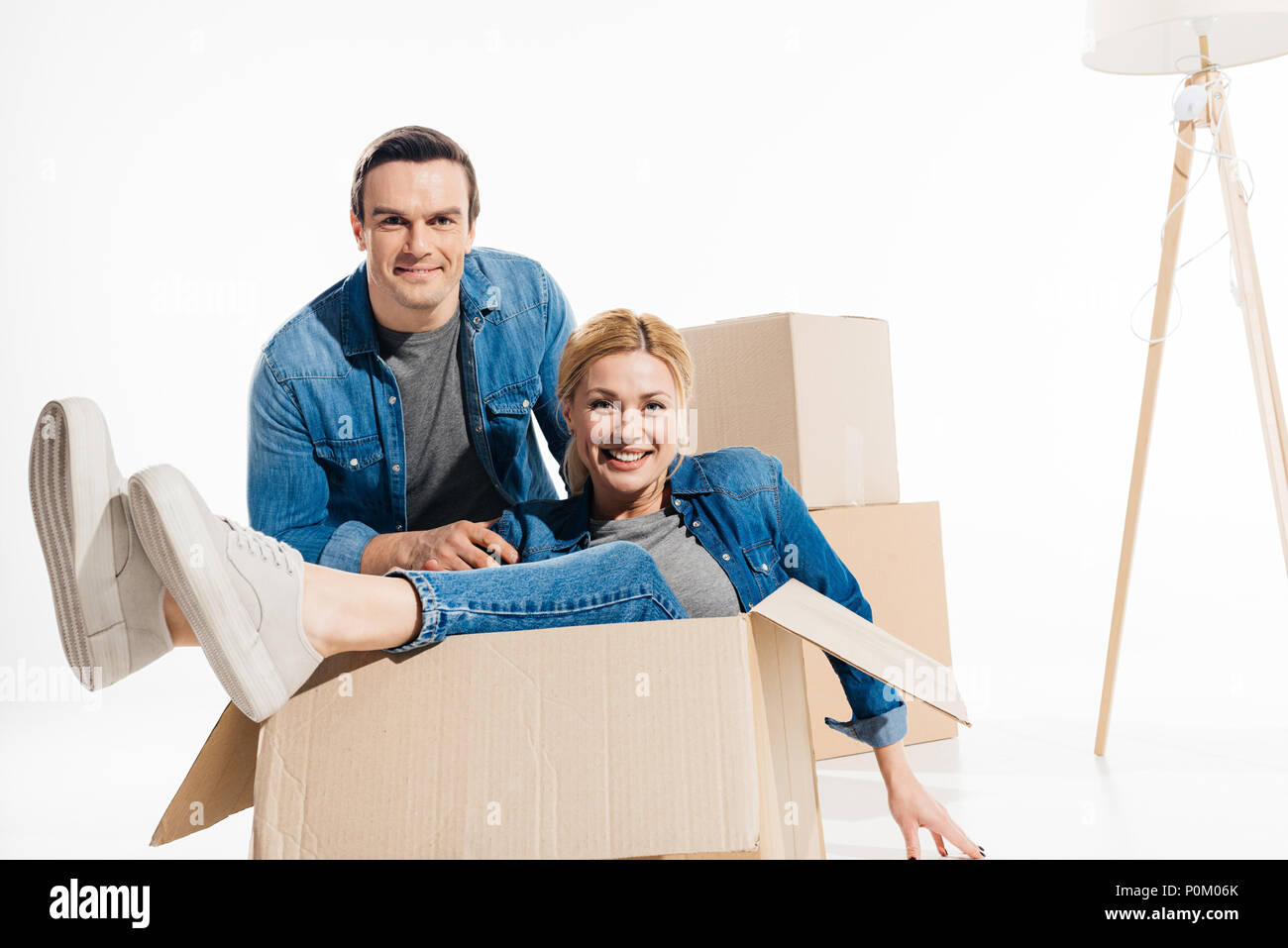 Young man sitting on box, studio hi-res stock photography and images ...