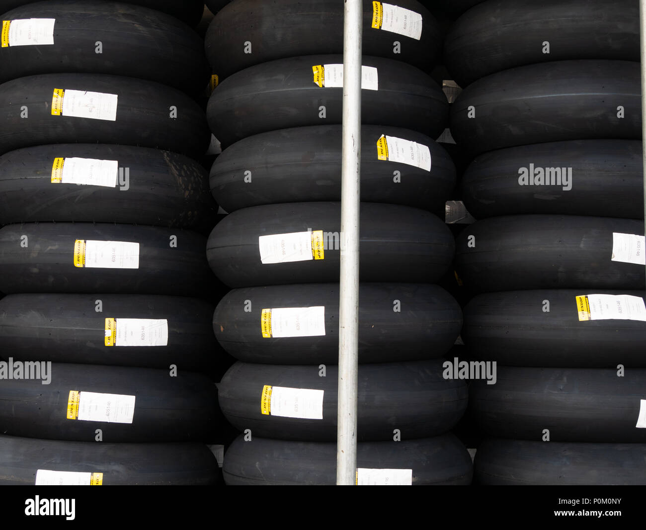 Stack of motorcycle tyres at the Isle of Man, TT Stock Photo - Alamy