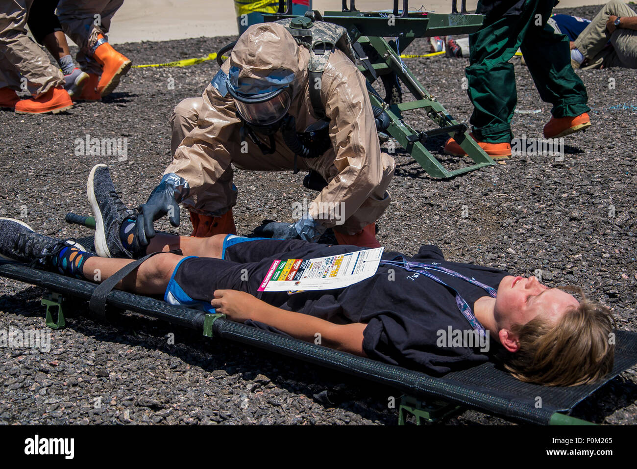 Memers of the Decontamination Team assess and transport exercise role ...