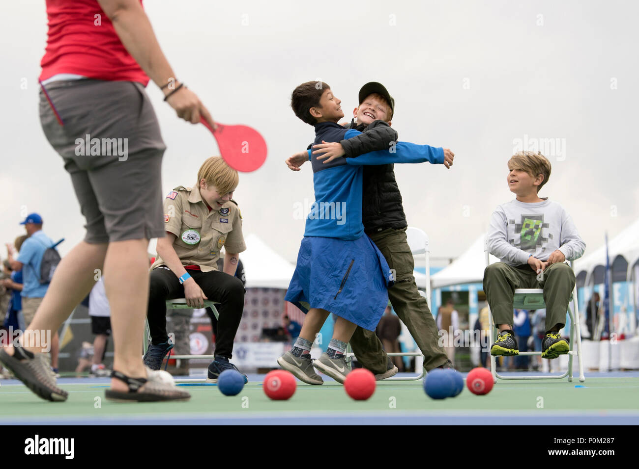 Boys celebrate a victory in a boccia game during an exhibition day for ...