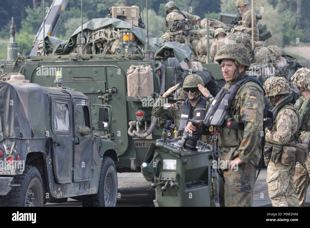 A Soldier from the German Bundeswehr guides a 3rd Squadron, 2d Cavalry ...